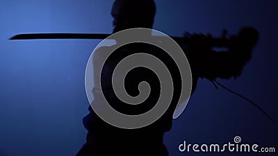 Bald Ninja in a Mask and a Kimono with a Katana in His Hands Attacks in ...