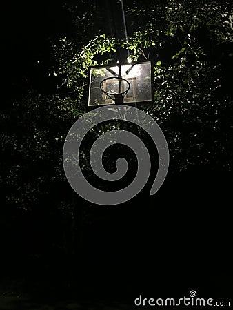 Basketball Ring At Night In The Light Of A Lantern. Outdoor Basketball ...