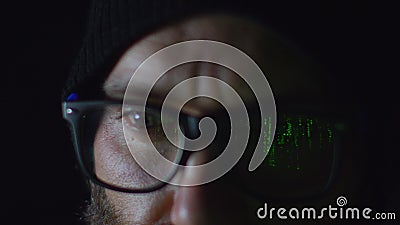 Bearded Hacker in Eyeglasses Working on Computer in the Night Green Programming Code Reflecting ...
