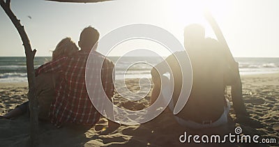 Beautiful Couples Sitting at the Beach Looking at the Waves Stock ...