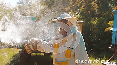 Bee-maker Beekeeper Man Working of a Smoke Pipe Beeper Smoker Device ...