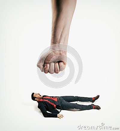 The Big Human Fist Bring Down The Man Off His Feet. Stock Photo ...
