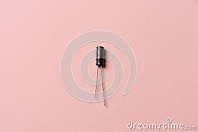 A Black Small Capacitor On Pink Background Stock Photo | CartoonDealer ...