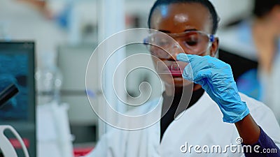 Black Lab Technician Doing Experiment in Lab Looking at Result Stock ...