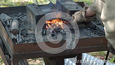 Blacksmith Heated the Iron Rod in Burning Coals in Forge Stock Footage ...