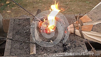 Blacksmiths Working Old Fashioned Bellows at the Forge. the Blacksmith ...