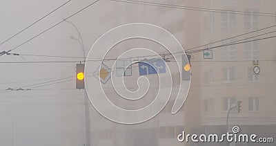 Blinking Yellow Traffic Lights at an Intersection in the City, with a ...