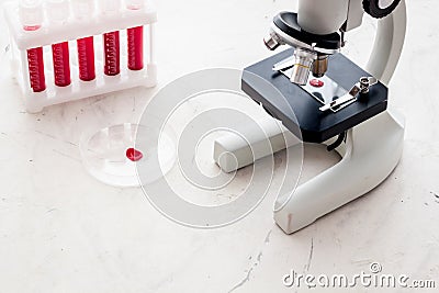 Blood Testing Laboratory. Samples Viewing Under Microscope Near Tubes ...
