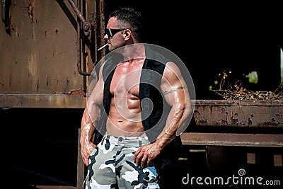 Bodybuilder Smoking A Cigar Stock Photo - Image: 34973680