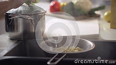 Boiling Pasta. Draining Macaroni Water through a Colander in the Sink ...
