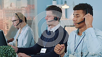 Bored Multiethnic Customer Support Operator Waiting for Telephone Call ...