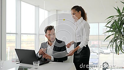 Boss Sign Document at Table, Secretary Holds in Hand Documentation in ...
