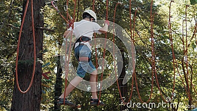 The Boy Climbs the Obstacle Course in the Camp. a Brave Boy Fulfills ...