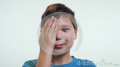 Boy Closing One Eye with Hand, Vision Test Stock Video - Video of ...