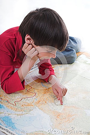 Boy Looks Map Stock Image | CartoonDealer.com #2375623