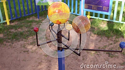 Boy is Playing and Studying a Mock-up of a Solar System. Planet Saturn ...