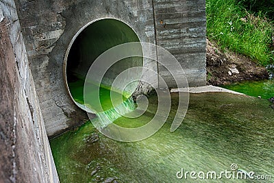 Bright Green Polluted Effluent Flowing Through A Drainage Pipe Stock ...