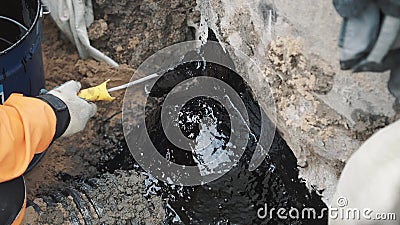 Builder Hand Put Tar on Cement Stitch between Black Plastic Pipe and ...