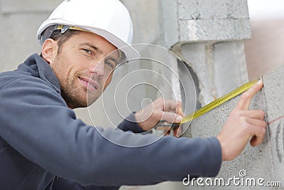 Builder Measures Wall Stock Image | CartoonDealer.com #188227939