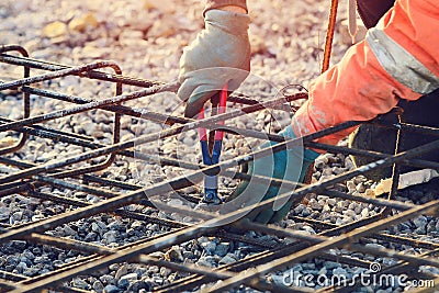 Builder`s Hands Fixing Steel Reinforcement Bars At Construction Site ...
