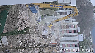 Builders Break Down an Old Multi-storey Residential Building ...