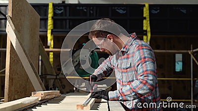 Building Contractor Worker Using Hand Held Worm Drive Circular Saw To ...