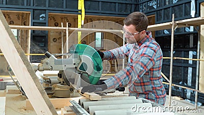 Building Contractor Worker Using Hand Held Worm Drive Circular Saw To ...