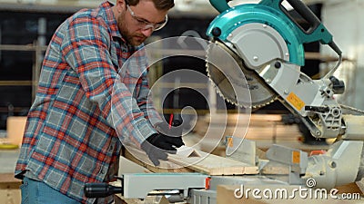Building Contractor Worker Using Hand Held Worm Drive Circular Saw To ...