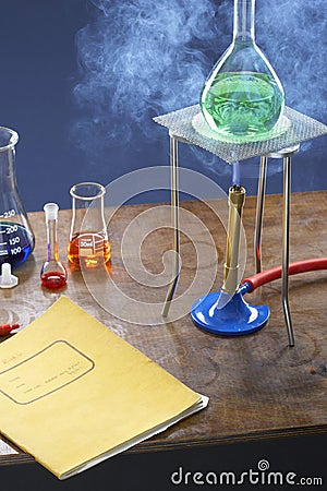 Bunsen Burner Heating Flask With Science Equipment In Laboratory ...