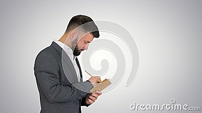 Business Man Writing Down Ideas on Gradient Background. Stock Video ...