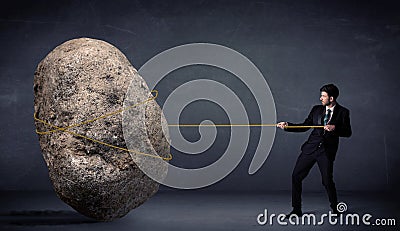 Businessman Pulling Huge Rock With A Rope Royalty-Free Stock Photo ...