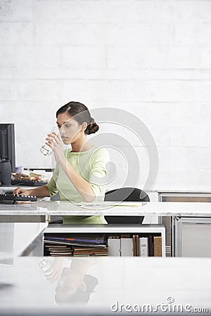 Businesswoman Drinking Water At Computer Desk Royalty Free Stock Images ...