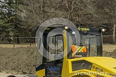 A Construction Worker Driving A BOMAG Single Drum Roller For Soil ...