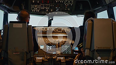 Captain and Woman Copilot in Cockpit Preparing To Fly Airplane Stock ...
