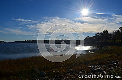 Captivating View Of The Ocean And The Large Sun With Its Rays Stock ...