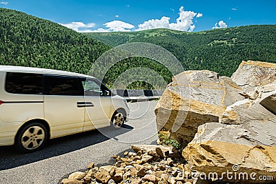 The Car Drives Around The Rockfall Partially Blocked The Mountain Road ...