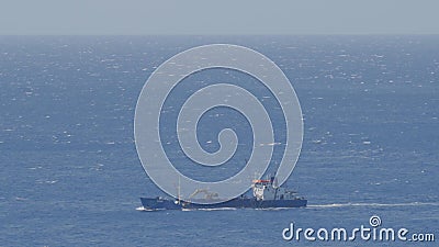 Cargo Ship Passing by on Big Ocean Waves in the Distance Stock Footage ...