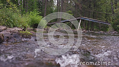 Cascade Falls, Fast Flowing Waterfall. River Flows Under a Wooden ...