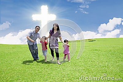 Catholic Family At The Cross Stock Image - Image: 29196451