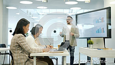 CEO Talking To Staff during Briefing Using Digital Interactive ...