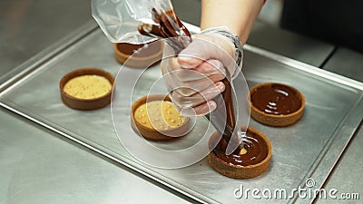 Chef Adding Melted Chocolate in Piping Bag To the Baked Cookies on a ...