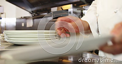 Chef tidying up the plates stock video. Video of profession - 70470881