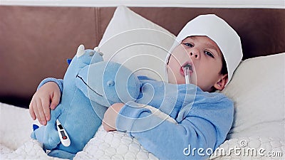 Child Coughs, Kid with Compression on Head for Colds Lying in Bed, Baby ...