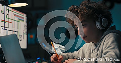 A Child Designs a Building for Tech Class, Does Homework, Draws with a ...