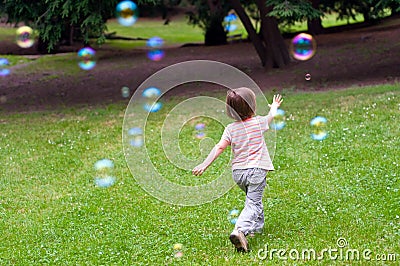 Child Playing With Bubbles Stock Photos - Image: 16677913