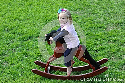 Child On Rocking-horse Royalty-Free Stock Photography | CartoonDealer ...