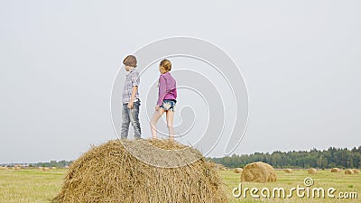 Children Playing on Haystack Stock Footage - Video of dancing, kids ...