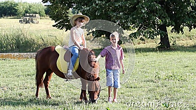 Children with pony horse stock footage. Video of country - 34996881