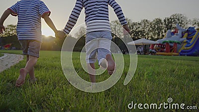 Children Running Barefoot Across the Lawn. Fun Outdoors Stock Video ...