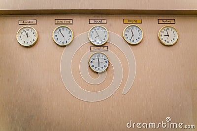 Clocks Shows Different Time Zones On Old Wall . Royalty-Free Stock ...